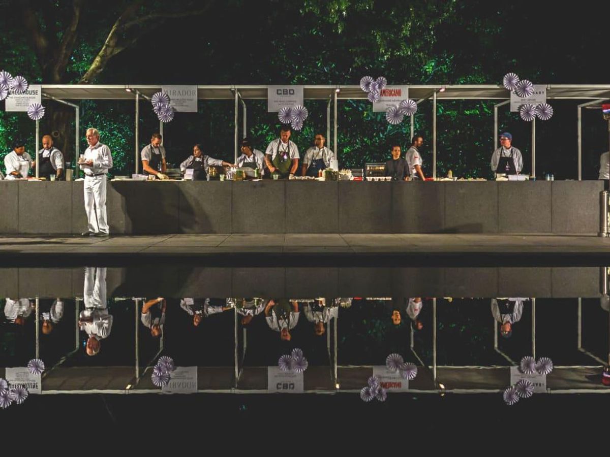Restaurant booths set up across reflecting pool. - CultureMap Dallas
