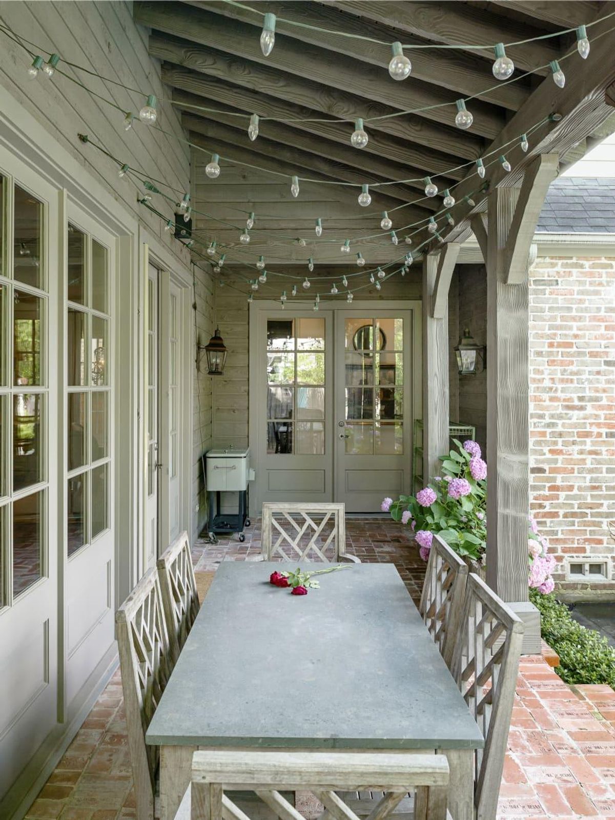 The covered outdoor dining area invites fun gatherings. - CultureMap Dallas