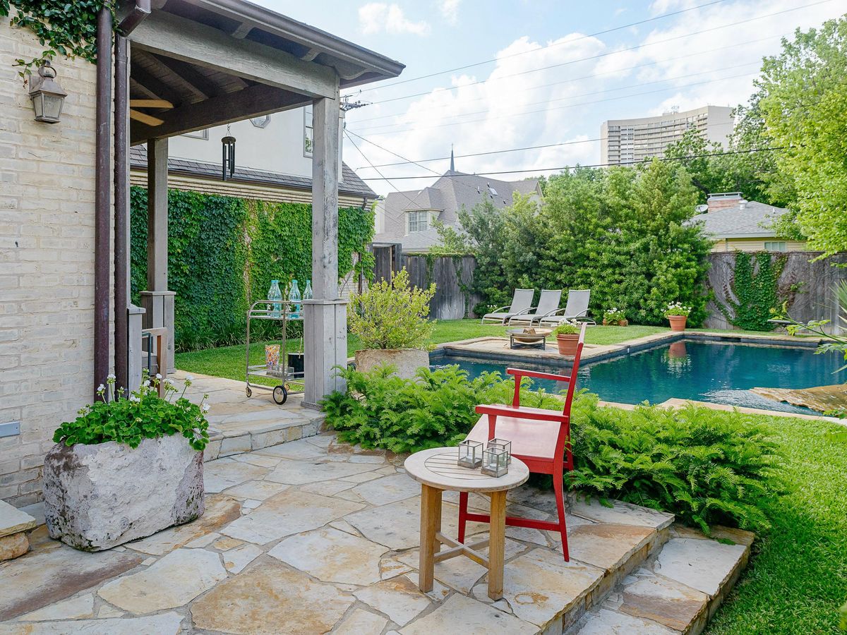 Gracious design, beautiful stonework and expert landscaping make the ...