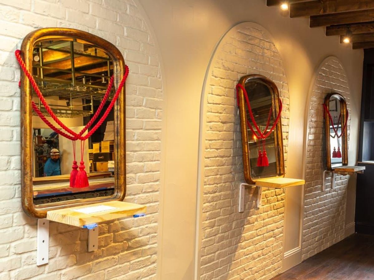 Mirrors are a thing. These will be stand-up tables in the bar ...