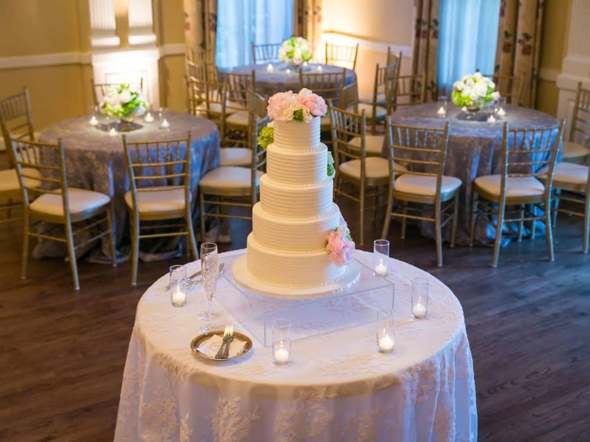 Panini Bakery provided the tiered wedding cake. - CultureMap Dallas