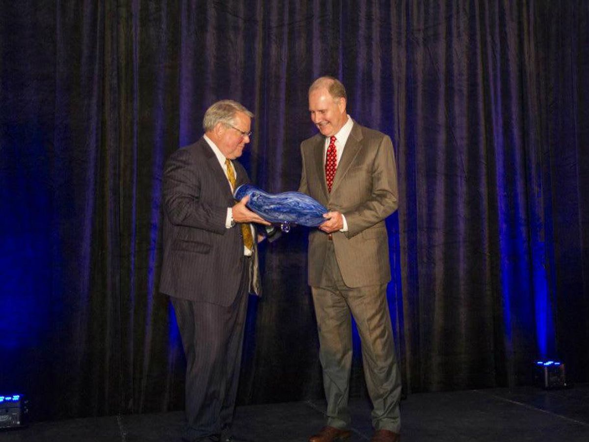 Don Clampitt presents Gary Kelly with his award. - CultureMap Dallas