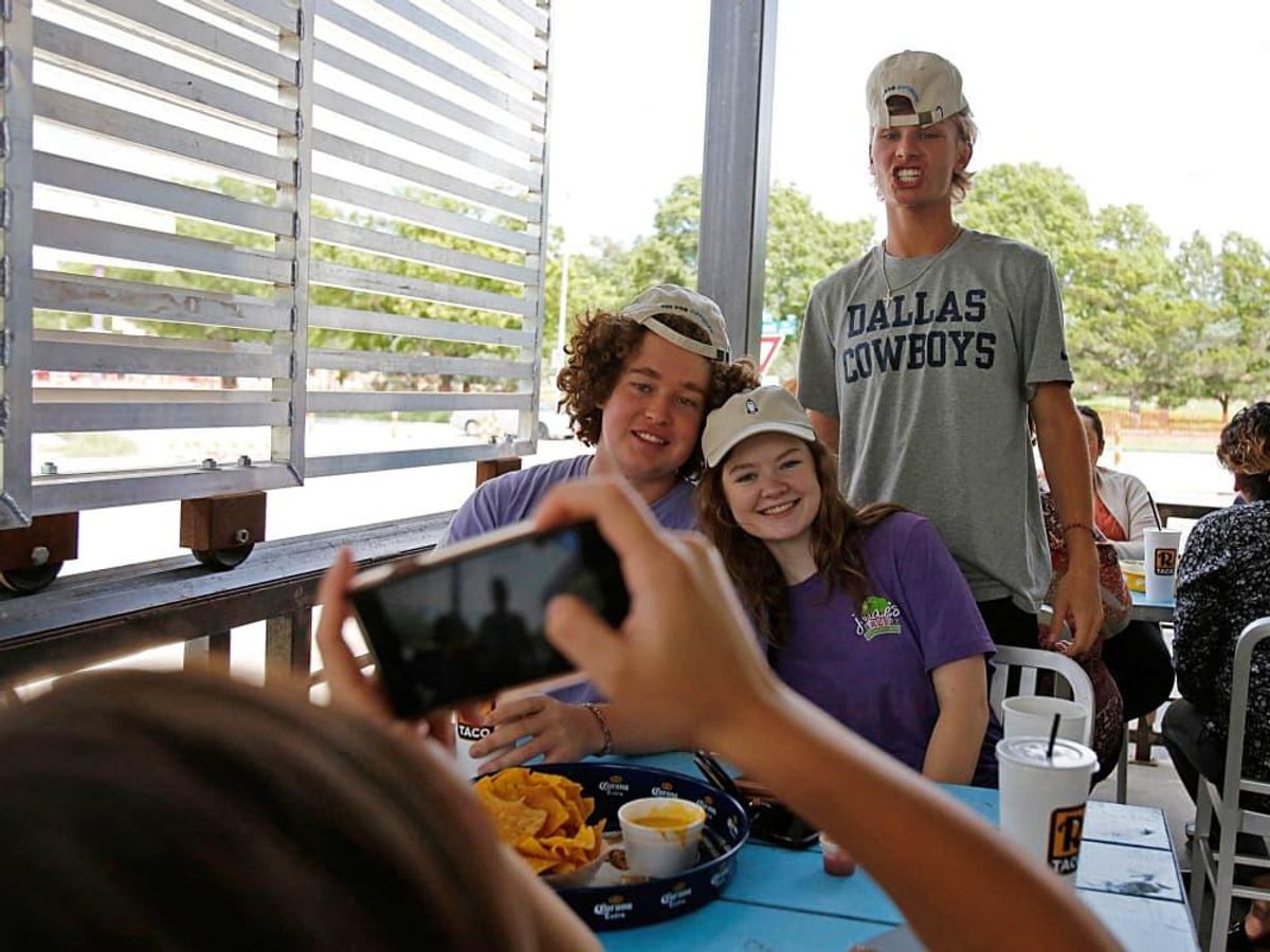 Zack Short, Lilly Guttery, and Fisher Tomlin model their new hats ...