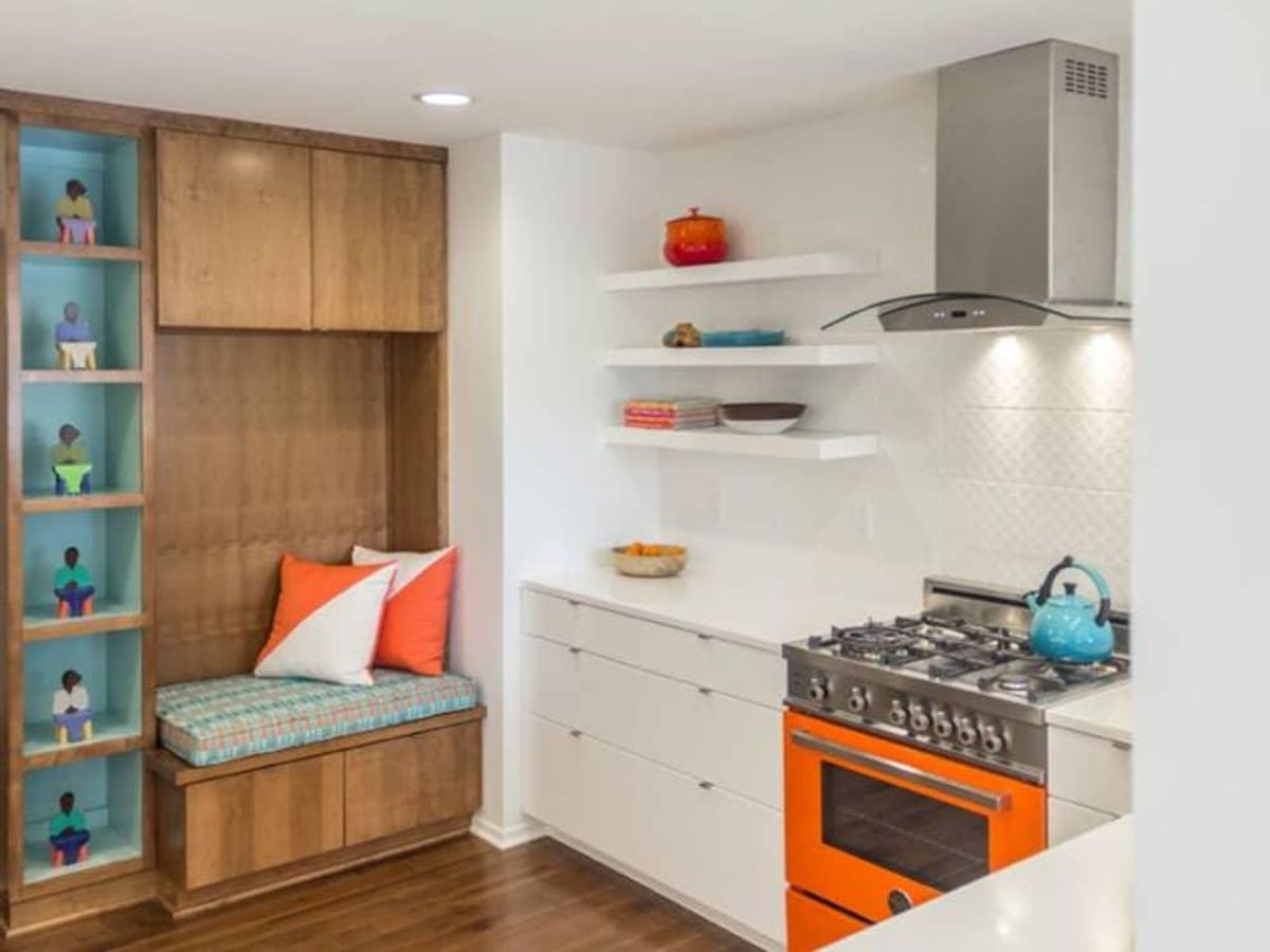 This kitchen boasts a cozy wood niche. - CultureMap Dallas